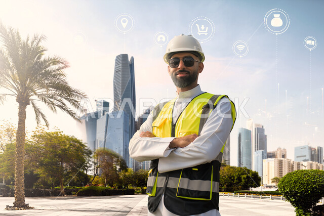 An Arab, Saudi, Gulf engineer wearing sunglasses with crossed hands ...