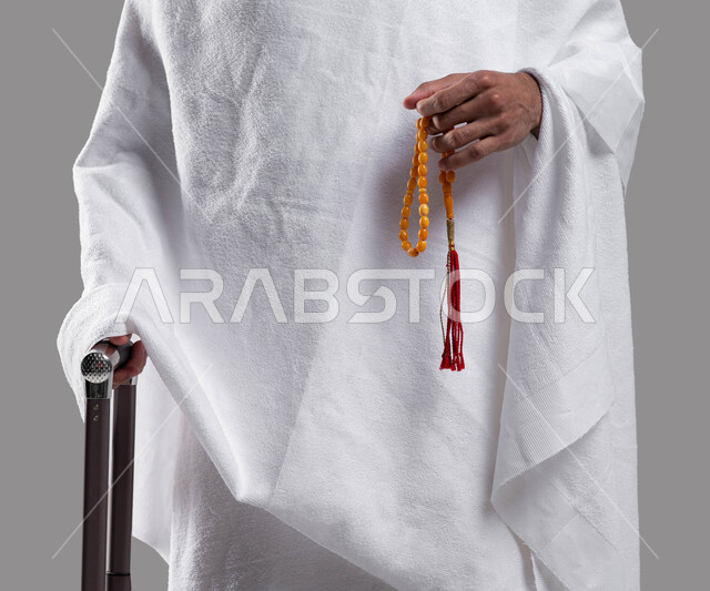 Wearing Ihram clothes, a close-up portrait of a Saudi Arab Gulf Muslim ...