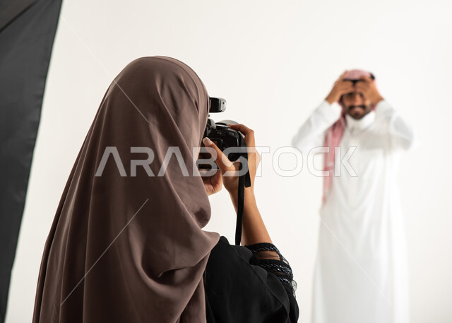A professional Saudi Arabian Gulf photographer taking photographs of a ...