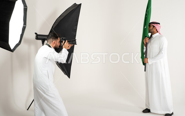 Celebration of the Saudi Flag Day, a man wearing the traditional Saudi ...
