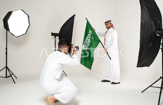 Portrait of a photo session in the studio, a man wearing traditional ...