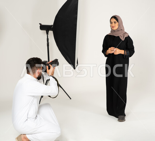 Portrait of a photo session in the studio, a modern model and models, a ...