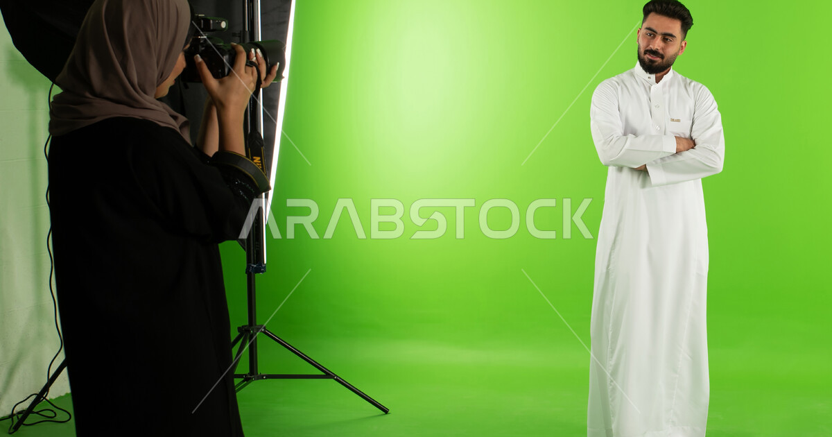 A professional Saudi Arabian Gulf photographer taking photographs of a ...