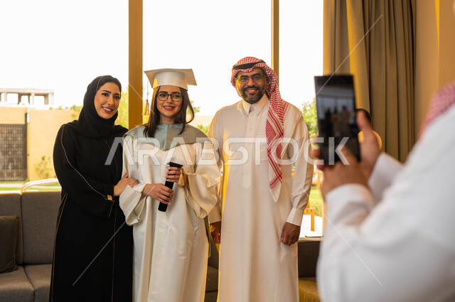 University graduation celebration, a Saudi Gulf Arab family taking ...
