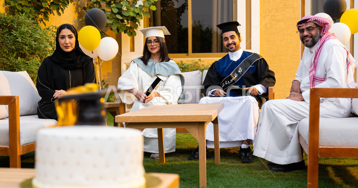 A happy Saudi Arab Gulf family celebrates the graduation of its ...