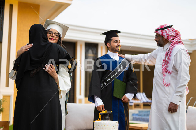 A mother embraces her daughter with joy at her graduation, a happy ...