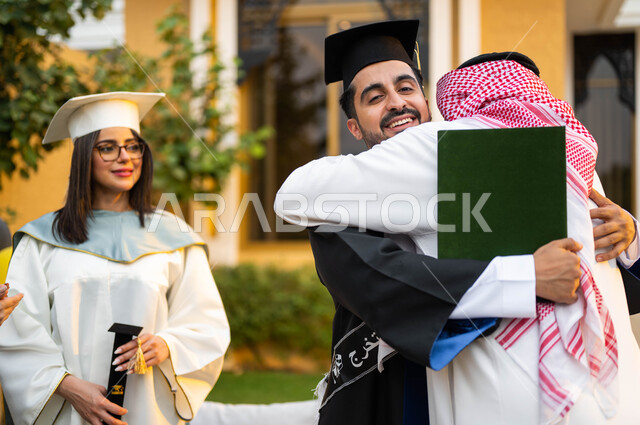 A happy Saudi Gulf Arab family, a Saudi Arab Gulf father embraces his ...