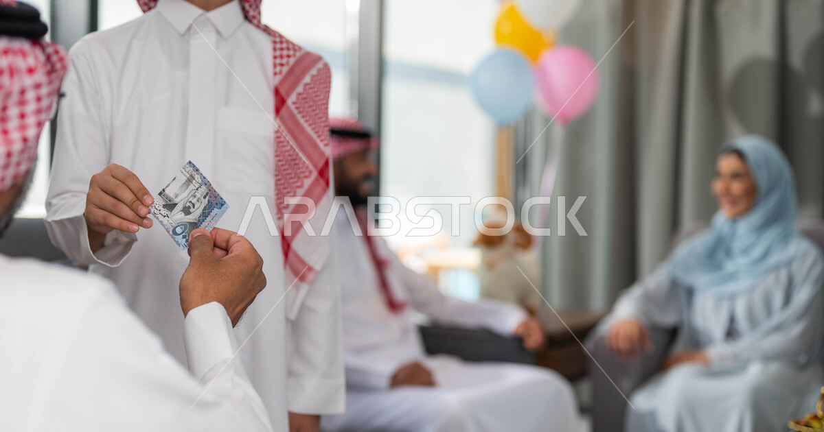 Eid atmosphere in the Saudi Arab society, offering Eidiya to the ...