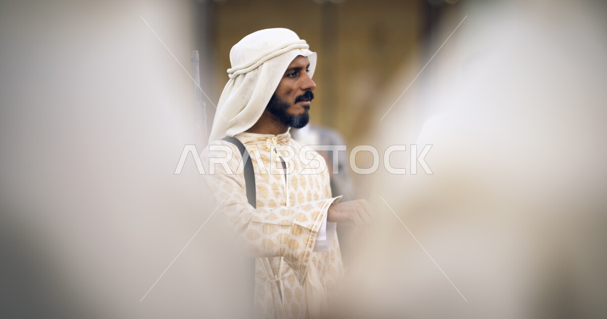 A Saudi Arabian Gulf man wears Saudi traditional dress at the opening ...
