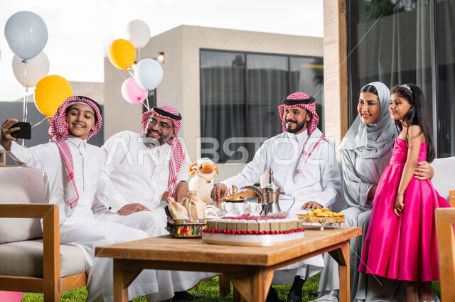 Taking selfies via mobile phone on the blessed Eid al-Adha, a family ...