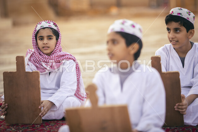 A group of young children dressed in traditional Saudi costume at the ...
