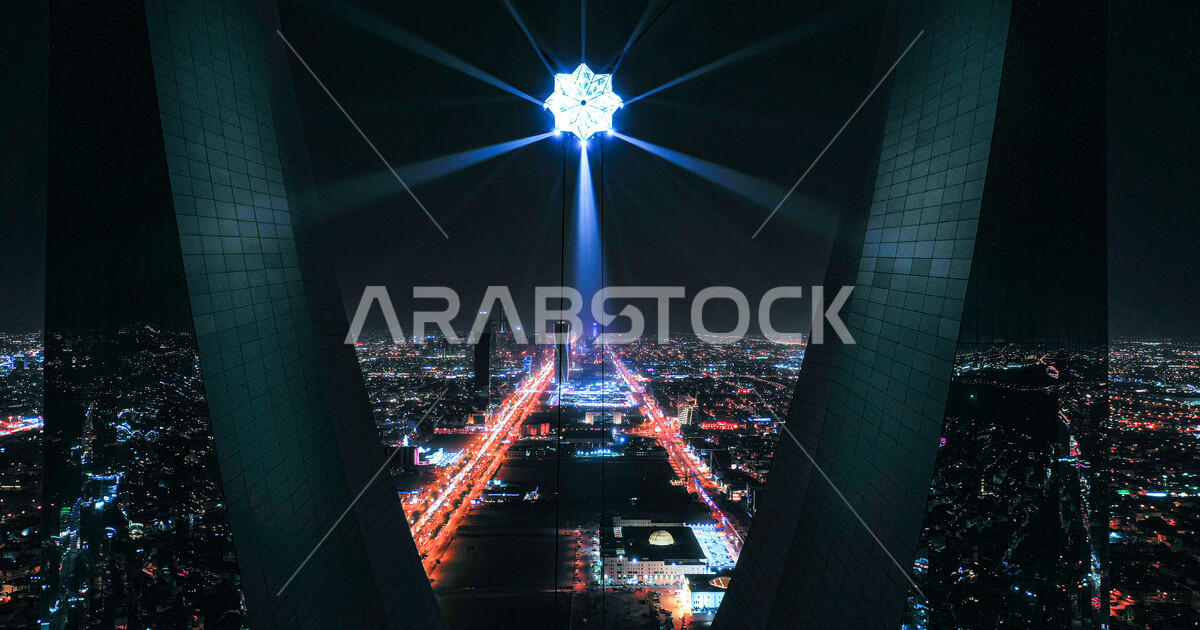 A close-up of the lights of Riyadh illuminated at night, the top of the ...