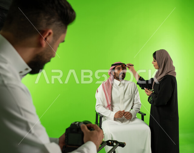 A professional Arab Saudi Gulf photographer who prepares a modern ...