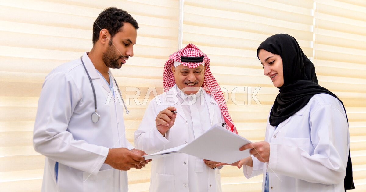 A group of Gulf doctors in a business meeting, reviewing disease ...