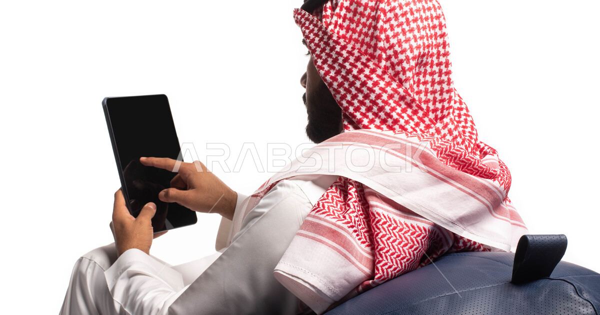 The use of modern technology devices, a close-up portrait of a Saudi ...
