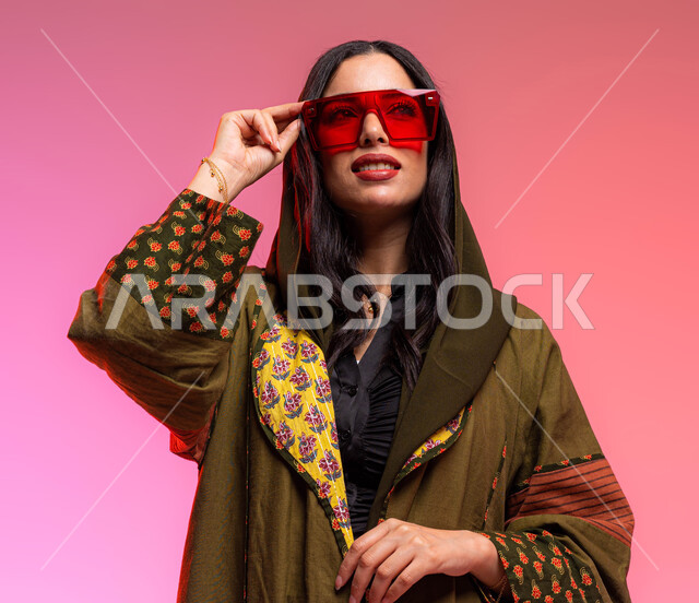 Buying new clothes and accessories, modern Gulf women's abayas, a ...