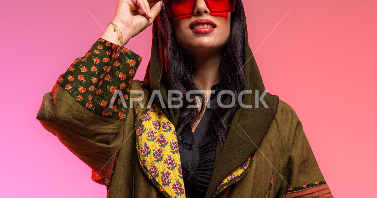 Buying new clothes and accessories, modern Gulf women's abayas, a ...