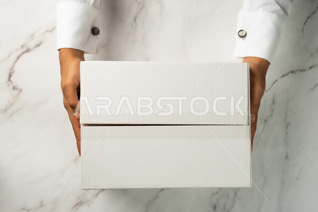 Mockup of a wrapped carton box, a white marble table, a close-up of a ...