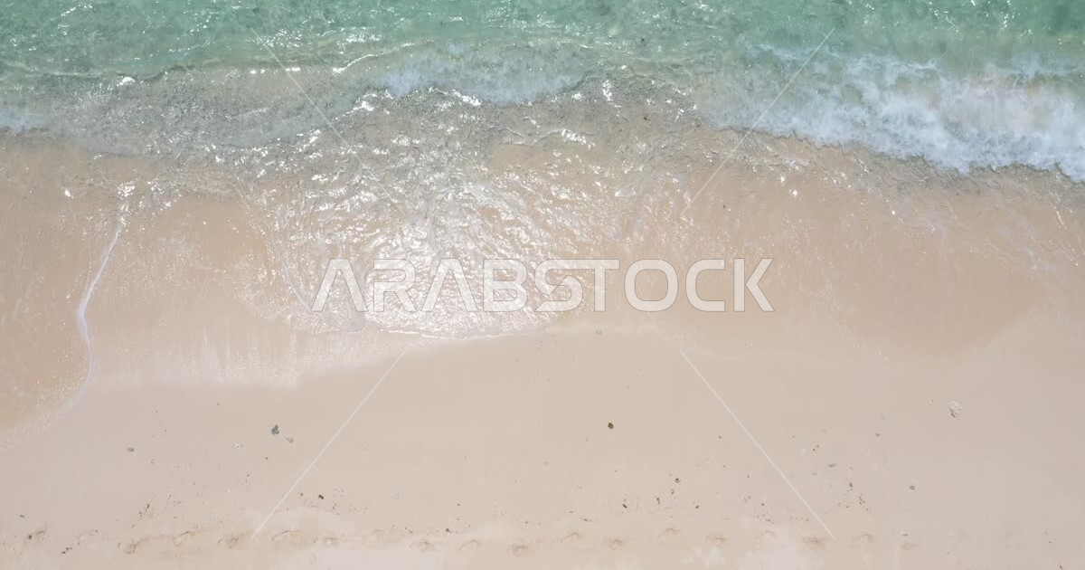 Sea waves on the beach in Asir, Saudi Arabia, blue water, white sand ...