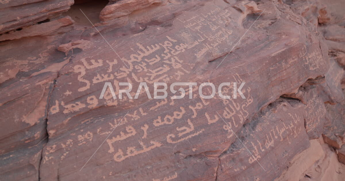 Photographing rock inscriptions scattered on the sandy rocky facades in ...