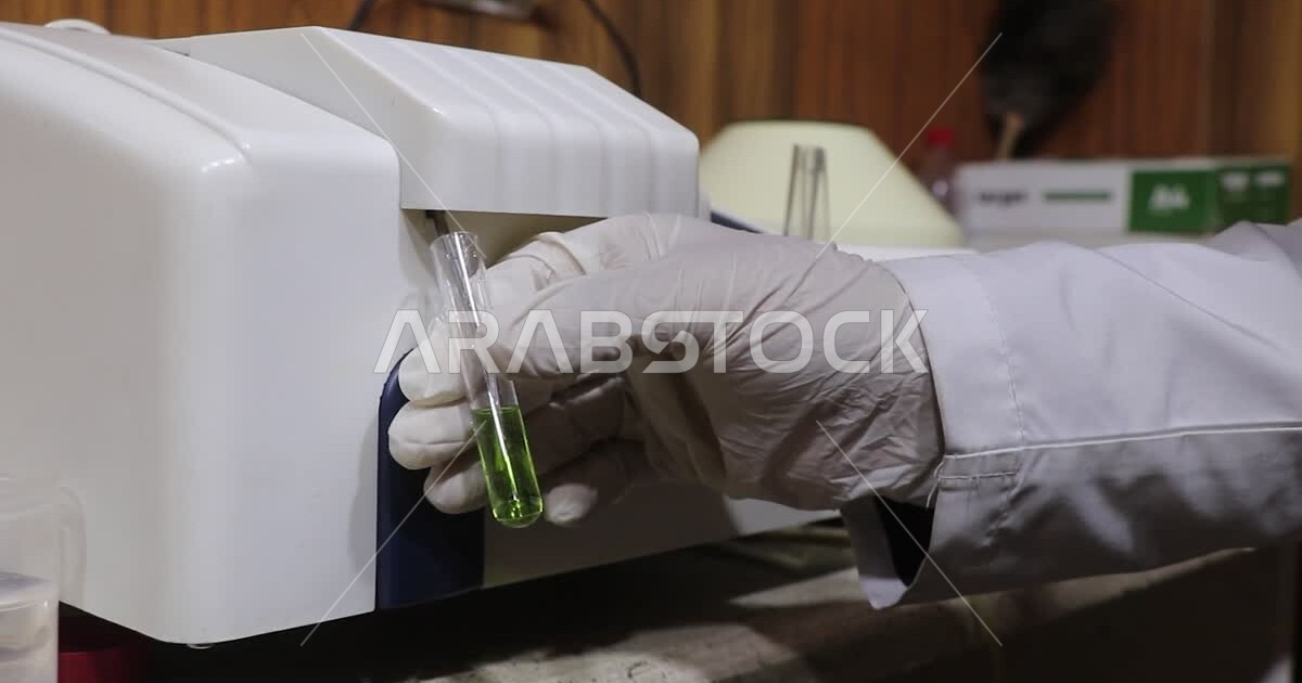 Close-up of a veiled Saudi Arabian Gulf woman wearing a medical coat in ...