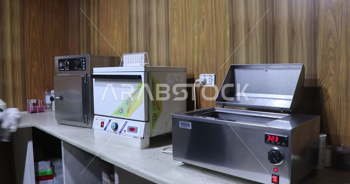 Close-up of a veiled Saudi Arabian Gulf woman wearing a medical coat in ...