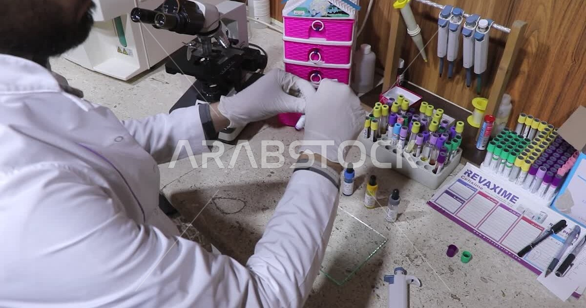 Close-up of a Saudi Arab Gulf man wearing a medical coat in the ...