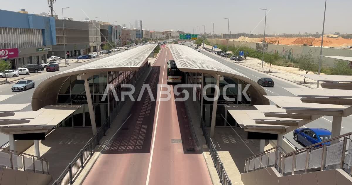 A bus at the Riyadh bus station, car traffic in the streets and roads ...