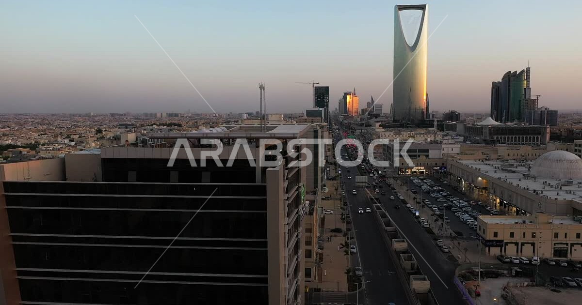 Roads and streets of Riyadh, car traffic in the morning, Kingdom Tower ...