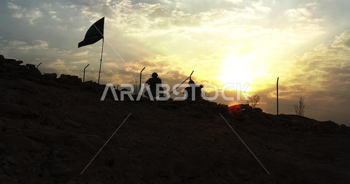 Silhouette depiction of the Saudi border guards at sunset, the Saudi ...