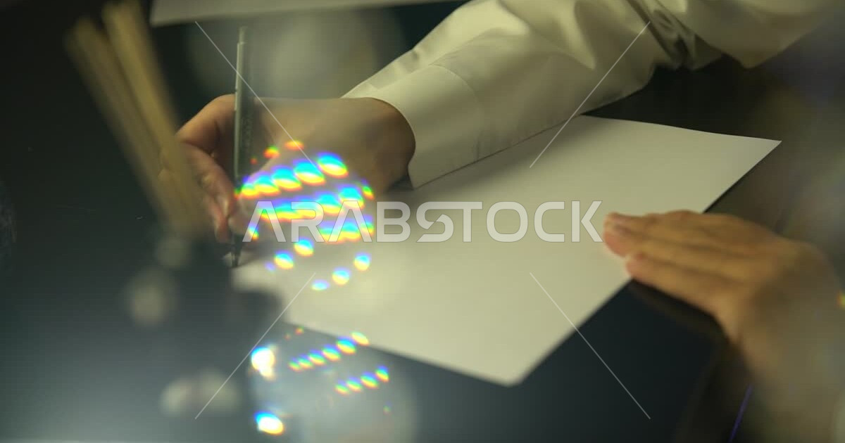 Artistic Arabic manuscripts, close-up of a Saudi Gulf Arab writer who ...