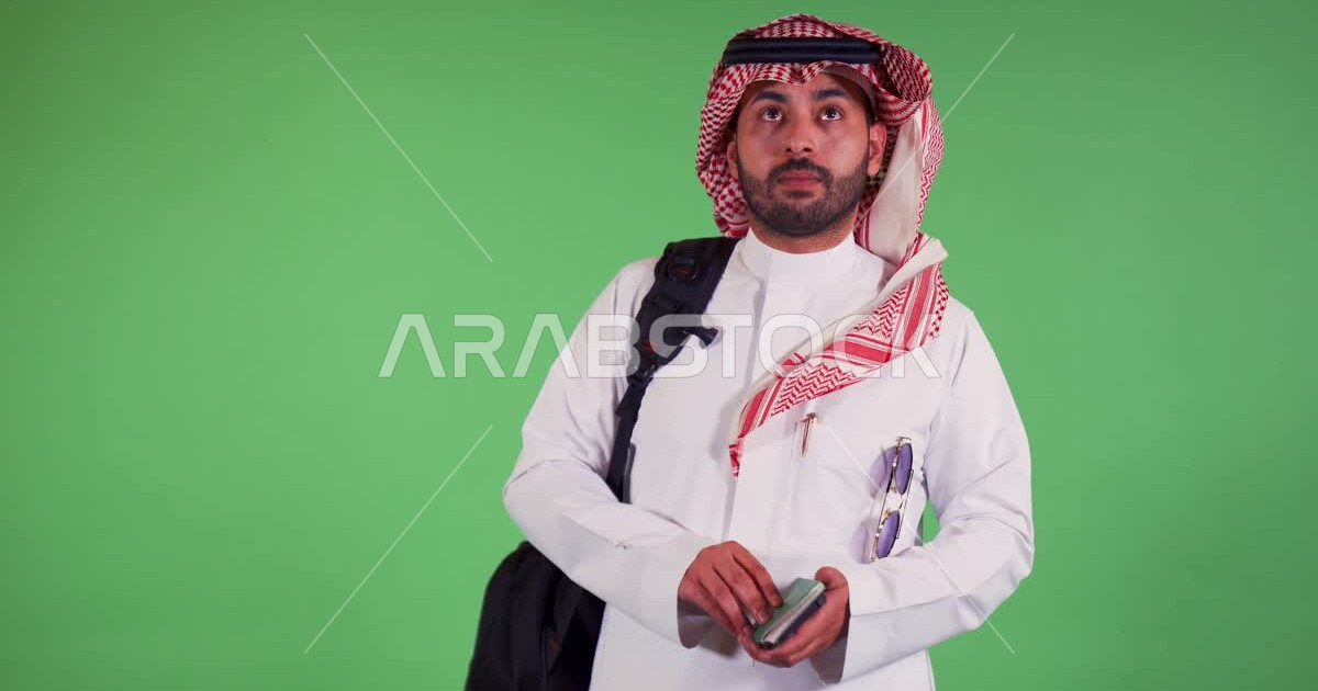 Chroma of a Saudi Arabian Gulf youth wearing a backpack, holding a ...