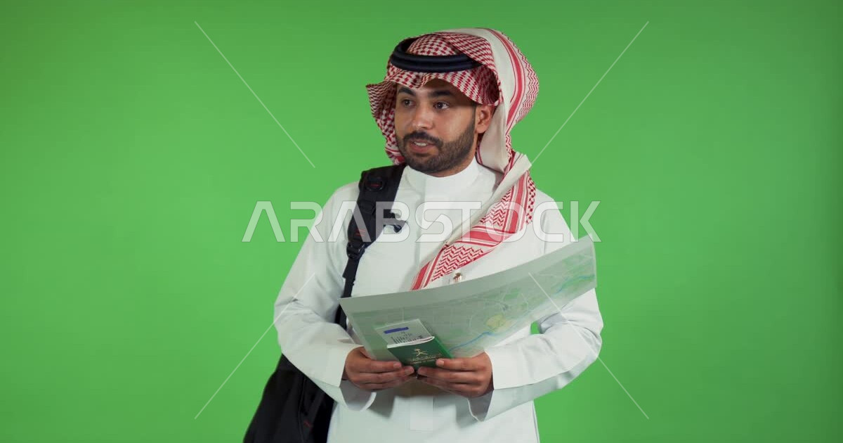 Chrome young Arab Gulf Saudi tour guide wearing traditional Saudi dress ...
