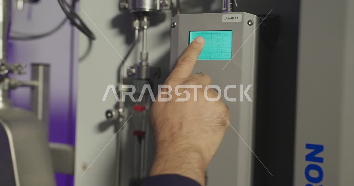Close-up of a Saudi Arabian Gulf man in a sophisticated factory, the ...
