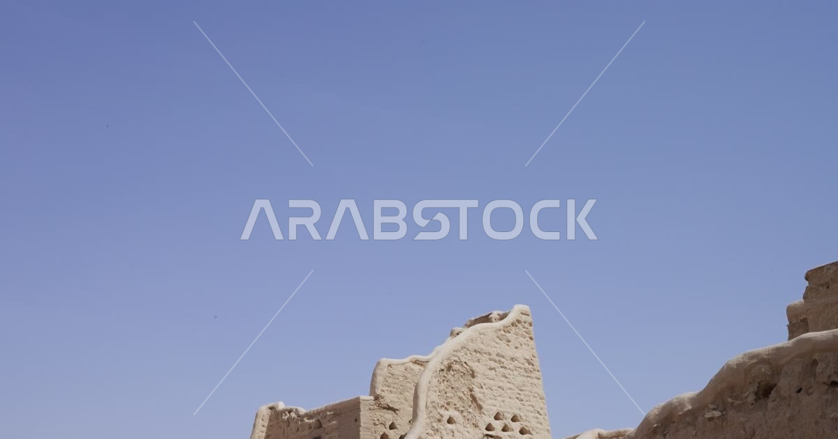 The mud walls of the heritage village in the ancient city of Diriyah in ...