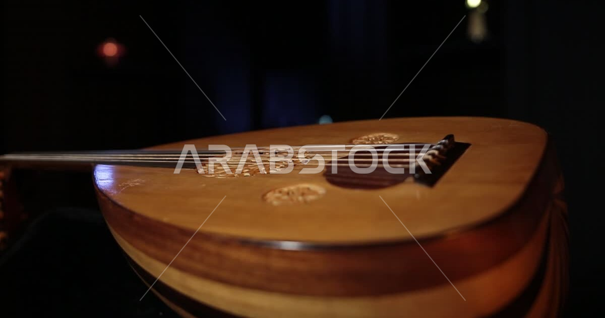 Practicing Saudi folk arts, a very close-up of the oud instrument ...