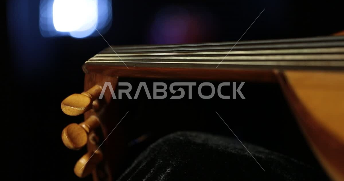 Practicing Saudi folk arts, a very close-up of the oud instrument ...