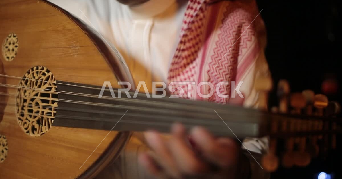 Close-up of the hand of a Saudi Arabian Gulf musician wearing ...