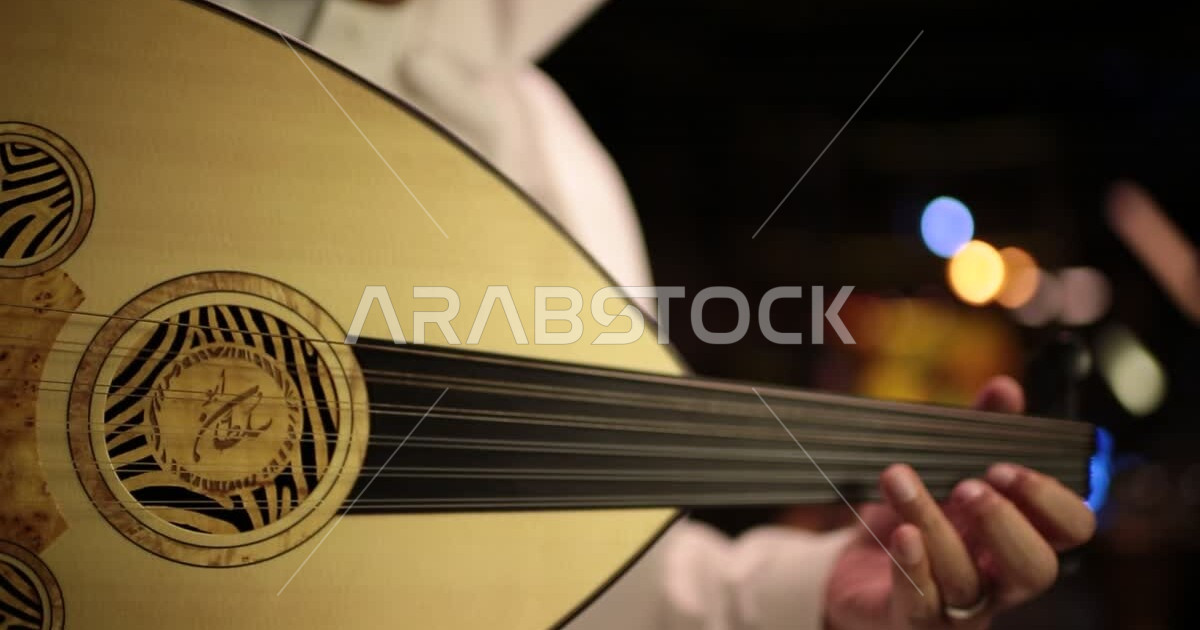 Close-up of the hand of a Saudi Arabian Gulf musician wearing ...