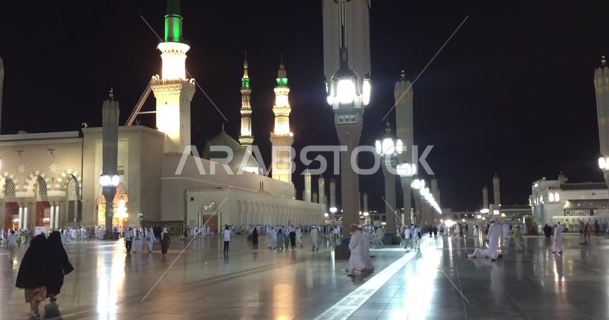 Muslims gathered in the outer complex of the Prophet's Mosque in Medina ...