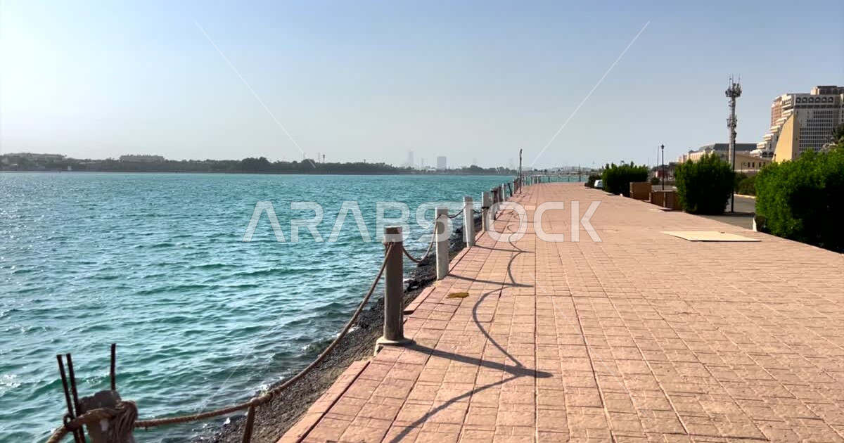 A walkway on the beaches and coasts of the sea, calm sea waves in ...