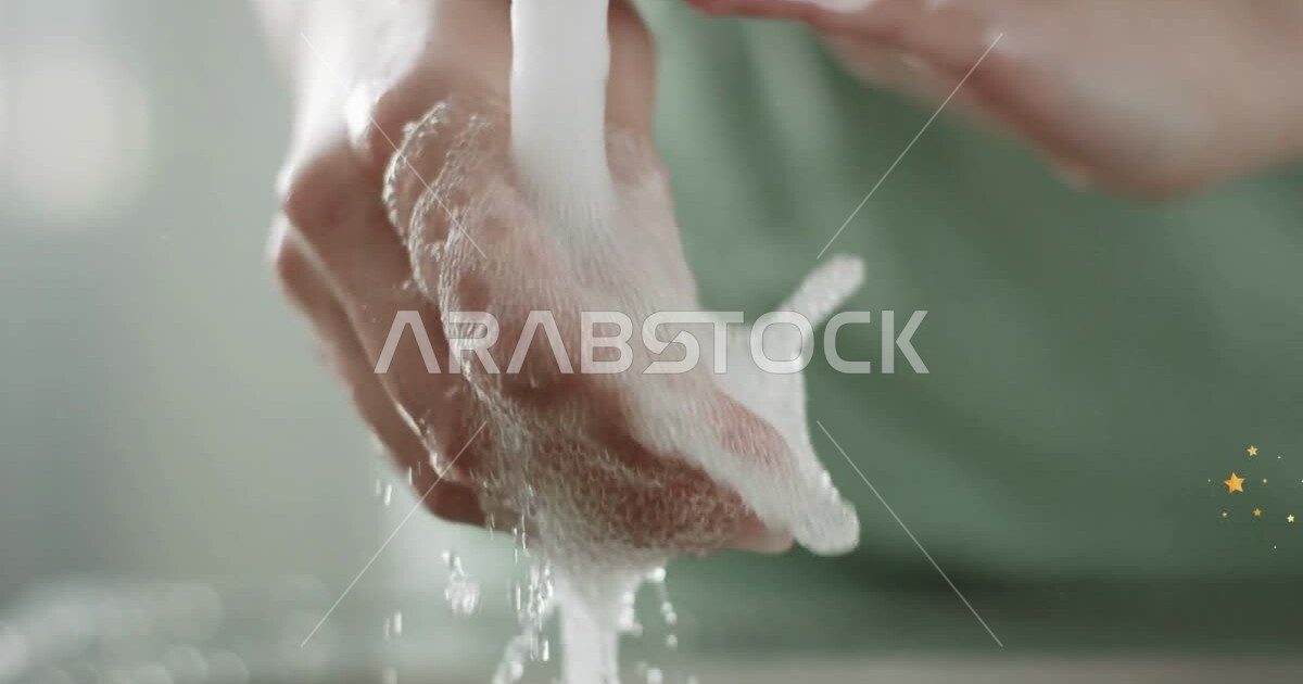 Close-up of a woman's hand washing her hands, washing and cleaning ...