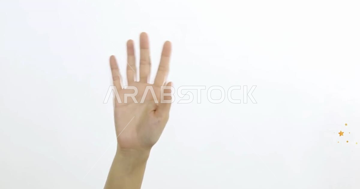 Close-up of a woman's hand waving, greeting, welcoming and farewell ...