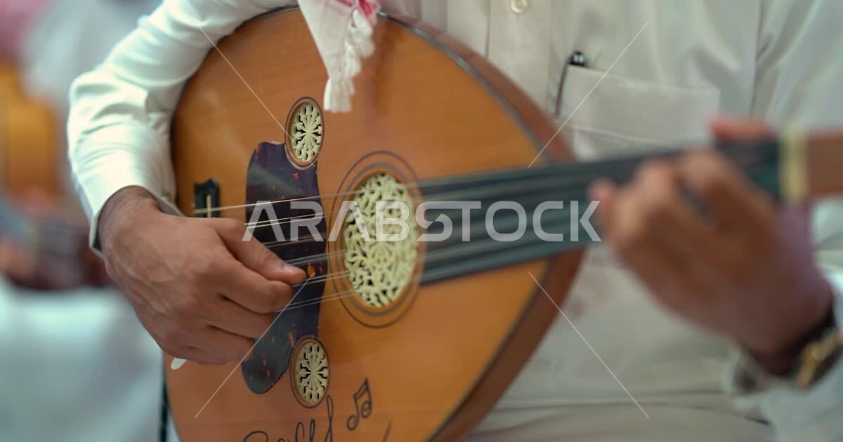 A close-up of a Saudi Arabian Gulf artist practicing the hobby of ...