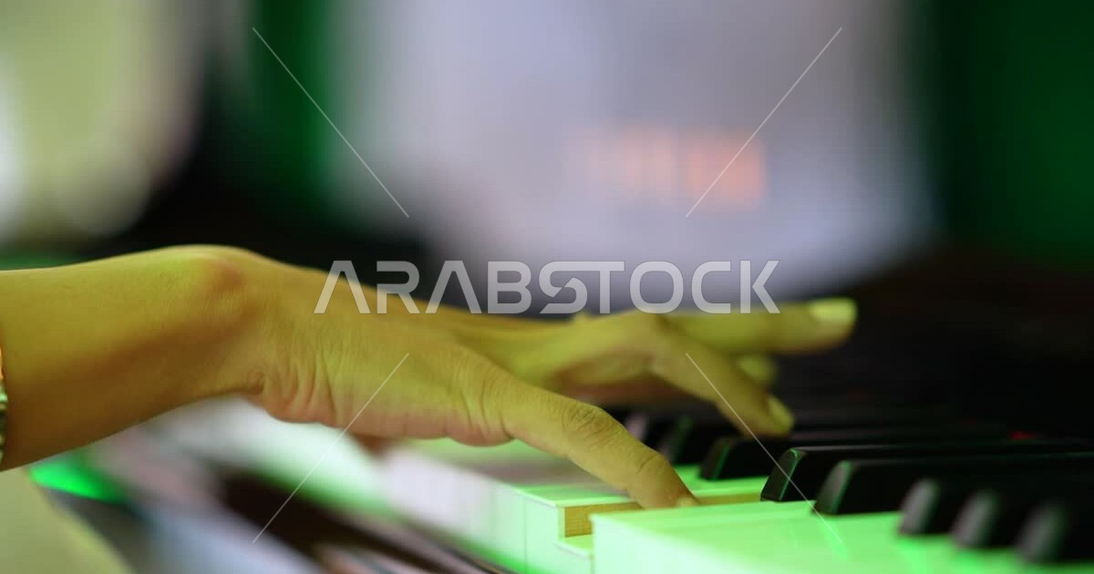 Close-up of a Saudi Arabian Gulf artist's hand enjoying playing the ...