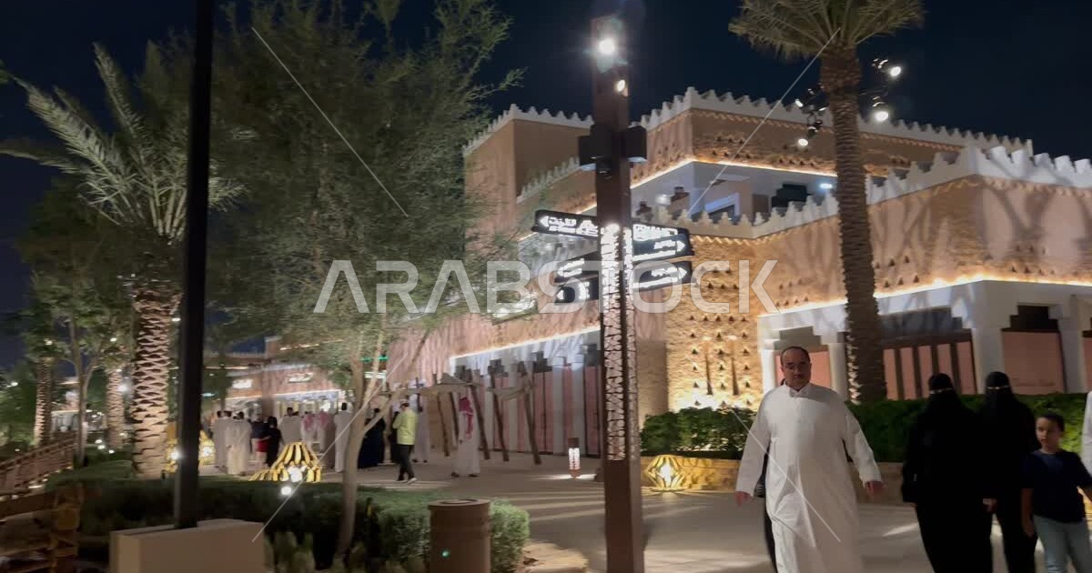 Cultivation of plants and palm trees, a group of visitors in the ...