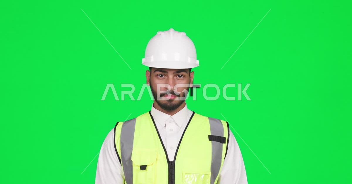 Chroma close-up of a Saudi Arabian Gulf engineer wearing a helmet and ...