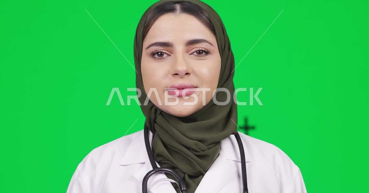Chroma close-up of a veiled Saudi Gulf Arab doctor wearing a white ...