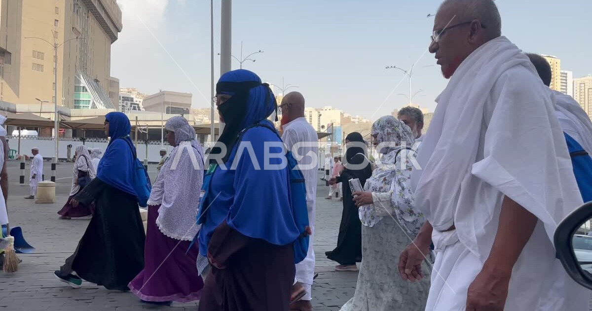 A close-up of pilgrims and Umrah performers on the way to Makkah Al ...