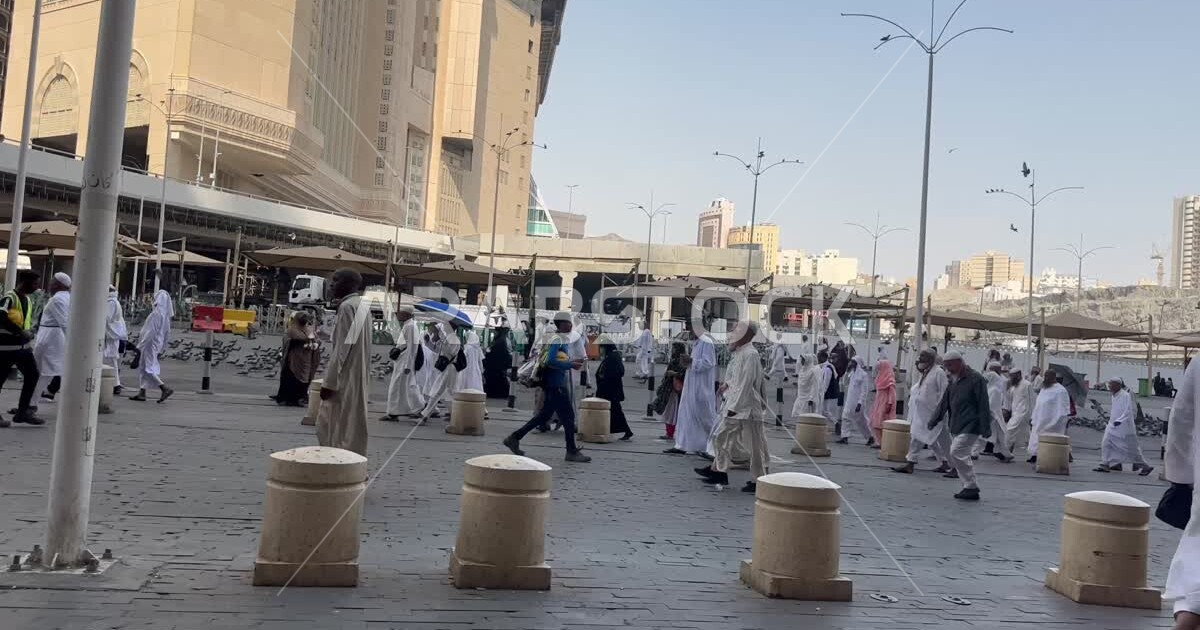 A close-up of pilgrims and Umrah performers on the way to Makkah Al ...